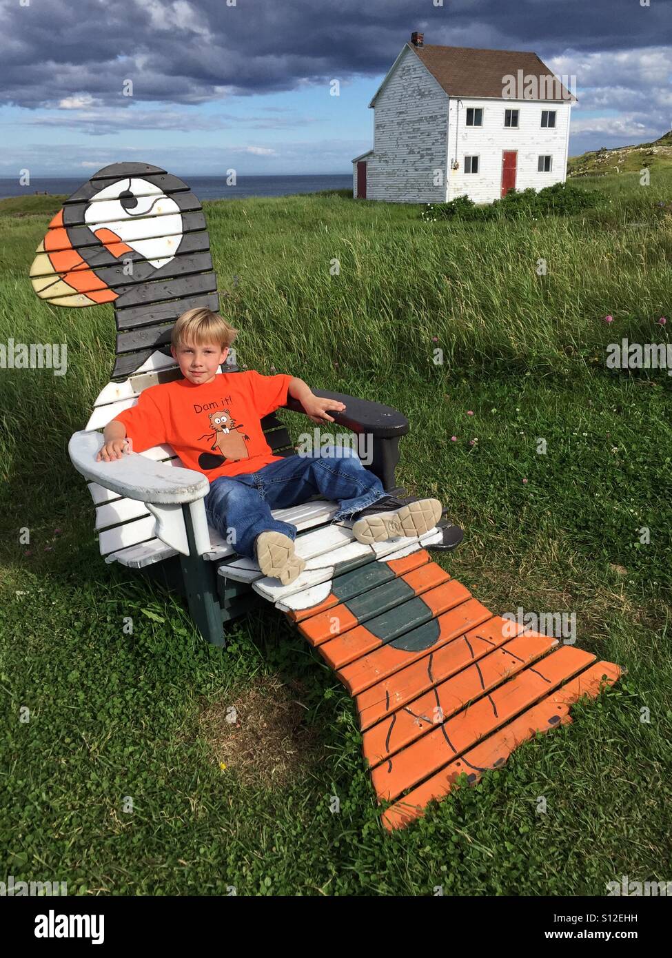 A boy on holiday on the Atlantic coast of Newfoundland, Canada Stock ...