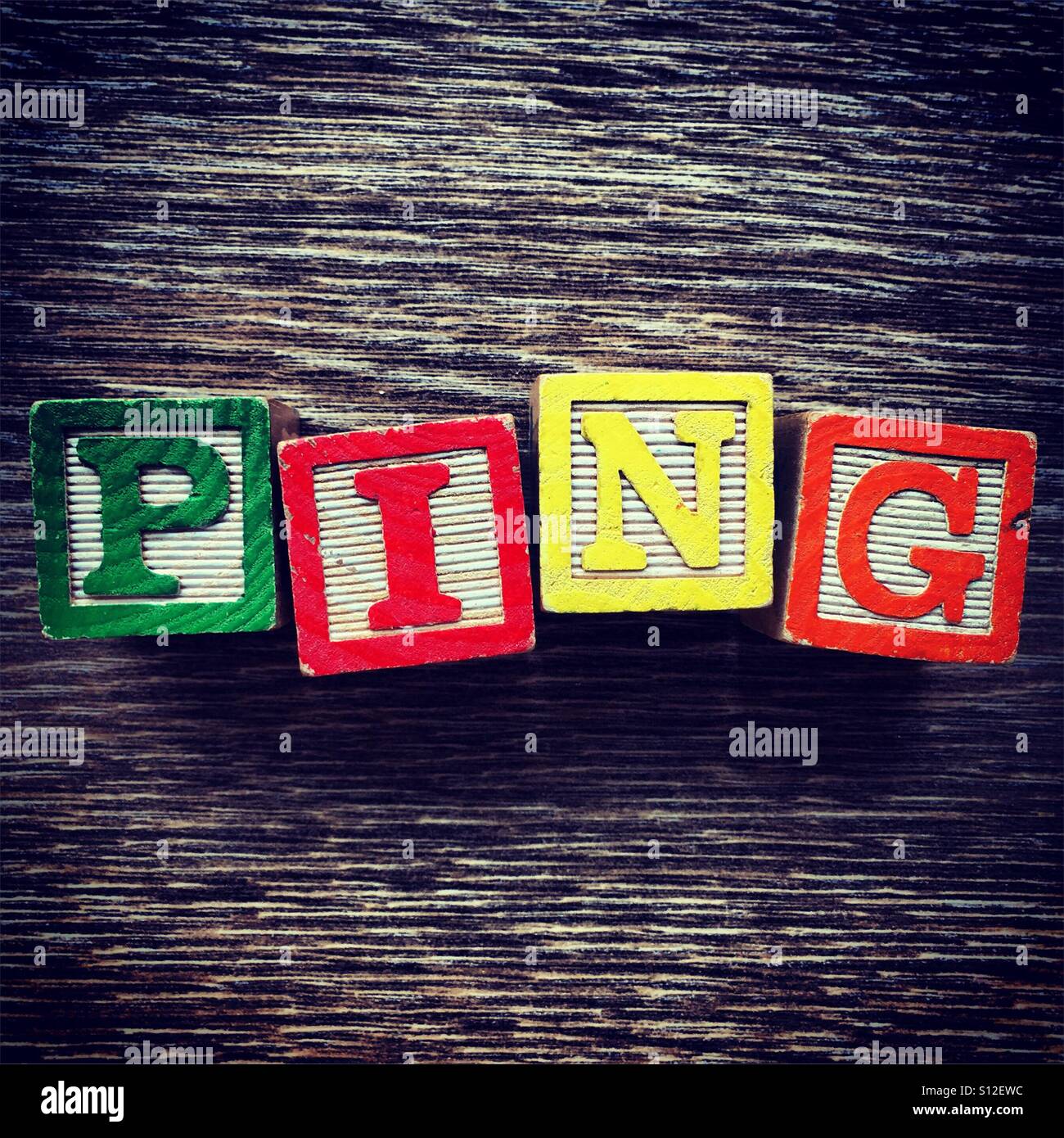 PING word written with wood block letter toys Stock Photo - Alamy