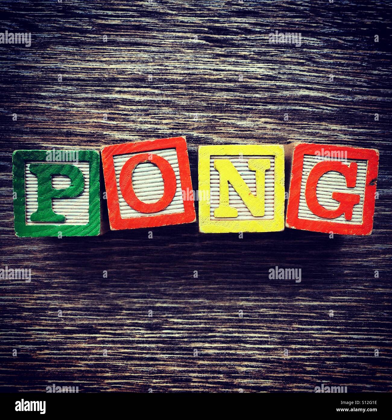 PONG word written with wood block letter toys Stock Photo - Alamy