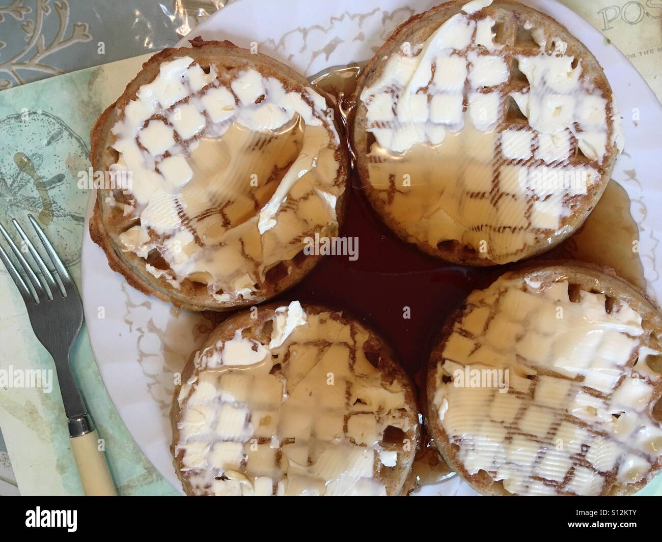 Whole grain blueberry waffles with far too much butter and syrup Stock ...