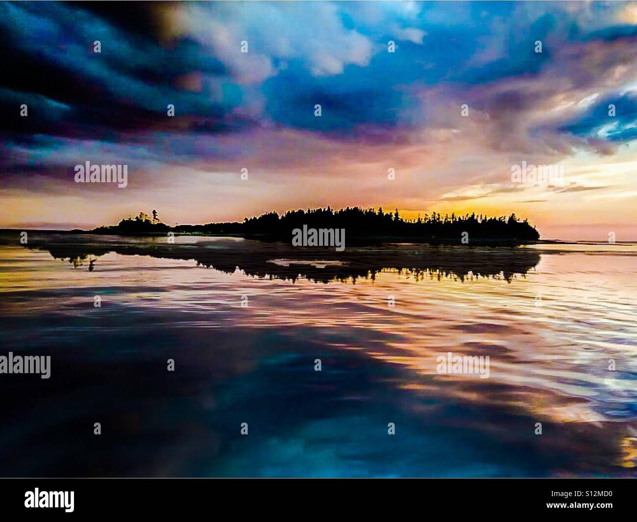 Island Ina dramatic sea Stock Photo - Alamy