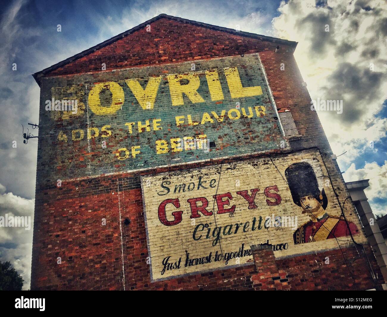Vintage painted adverts on s brick wall in Bedford, England, U.K Stock ...