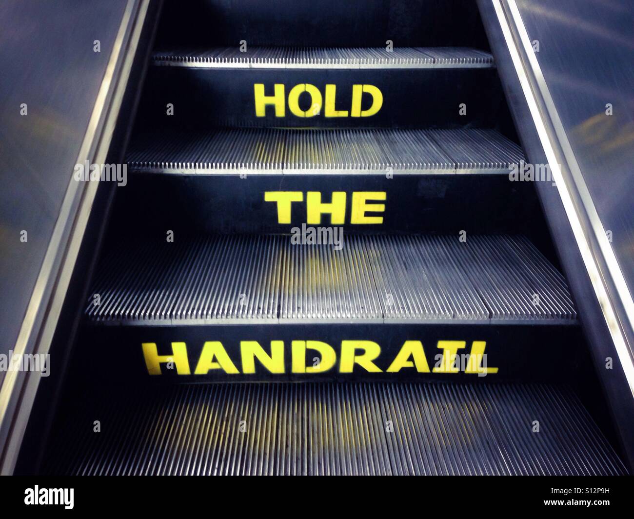 Hold The Handrail notice on escalator steps Stock Photo - Alamy Hold The Handrail notice on escalator steps Stock Photo - Alamy