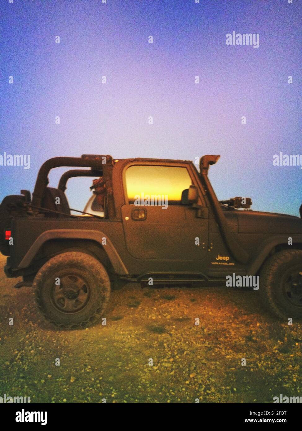 A Jeep off-road vehicle at sunset Stock Photo - Alamy