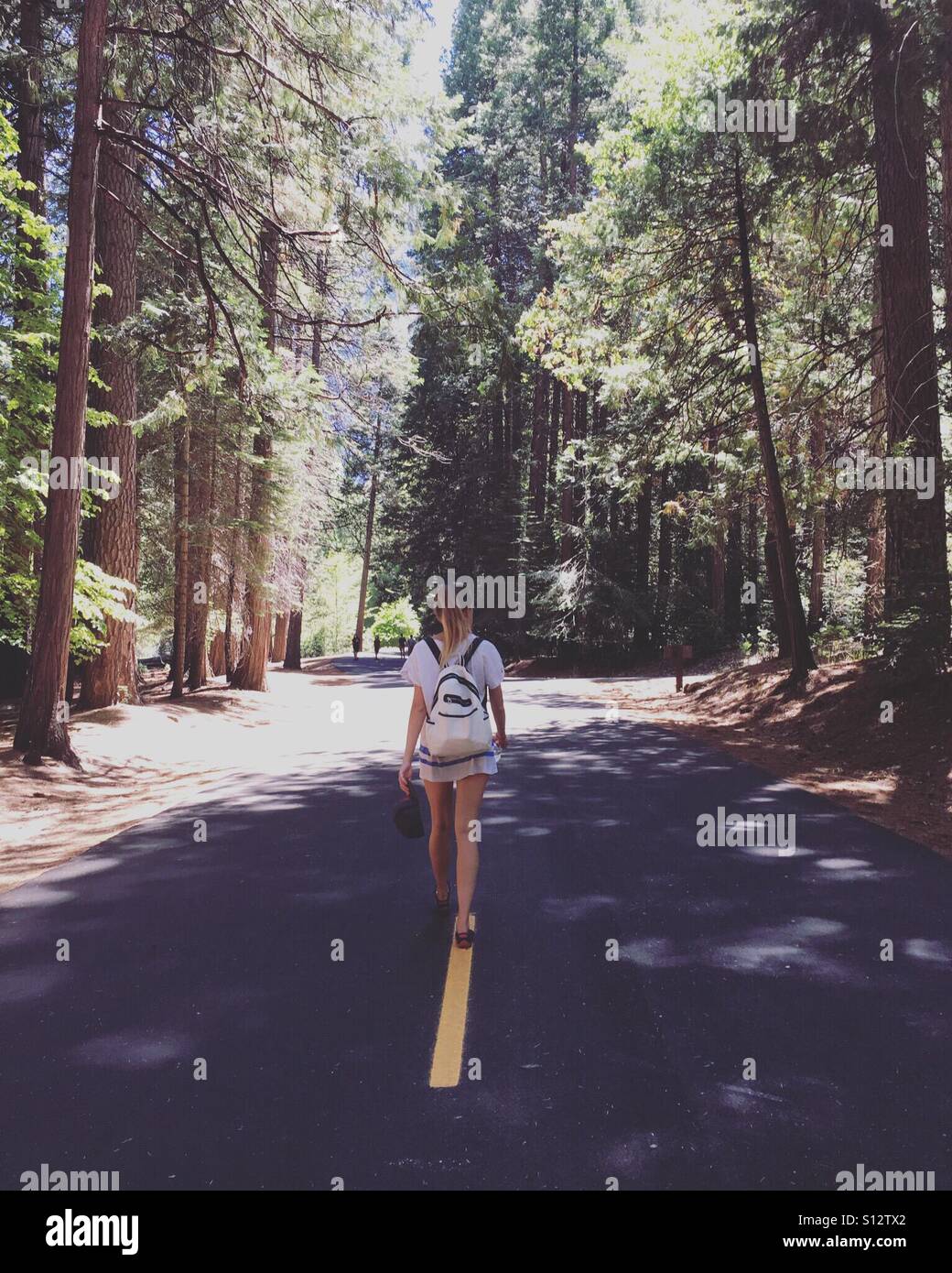 Girl walking away from camera hi-res stock photography and images - Alamy