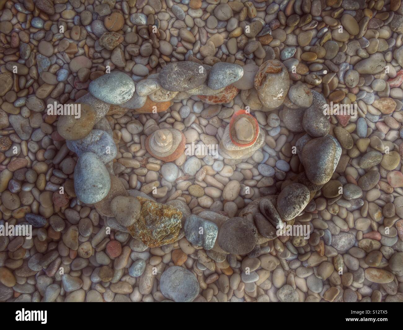 Pebble stack on a pebble beach Stock Photo - Alamy