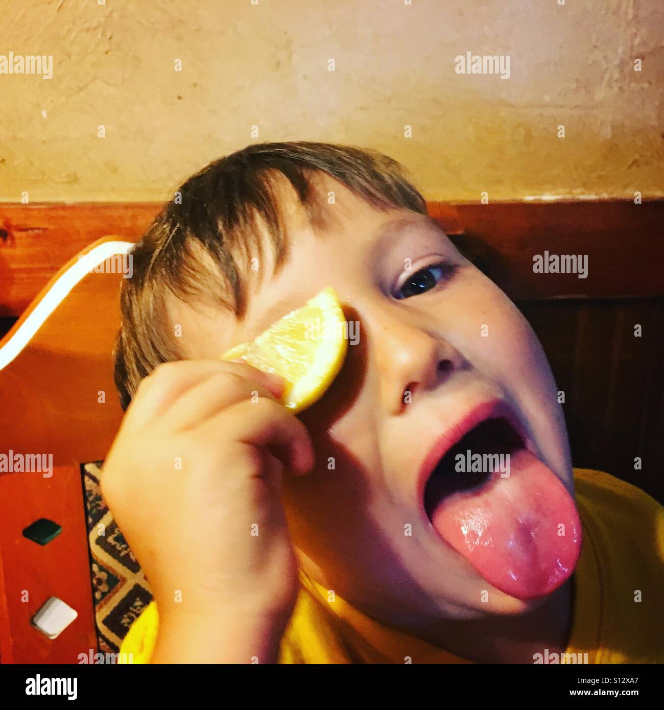 Boy eats lemon hi-res stock photography and images - Alamy