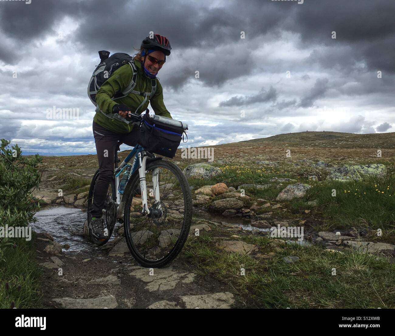 Extreme cycling tour on Hardangervidda mountain plateau, Norway Stock ...