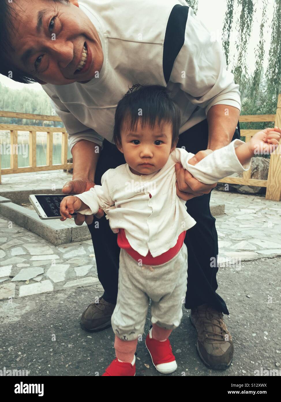 Chinese father and one year old baby Stock Photo - Alamy