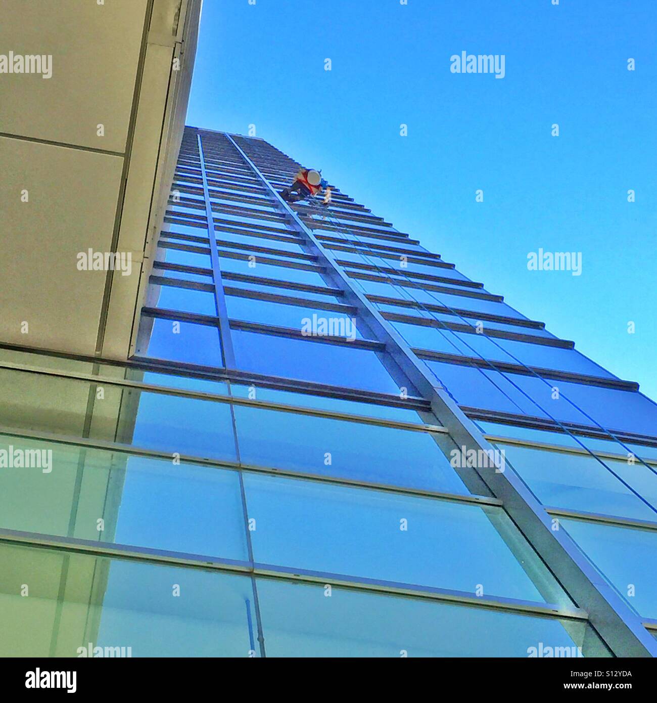 Window washer on an office tower Stock Photo - Alamy