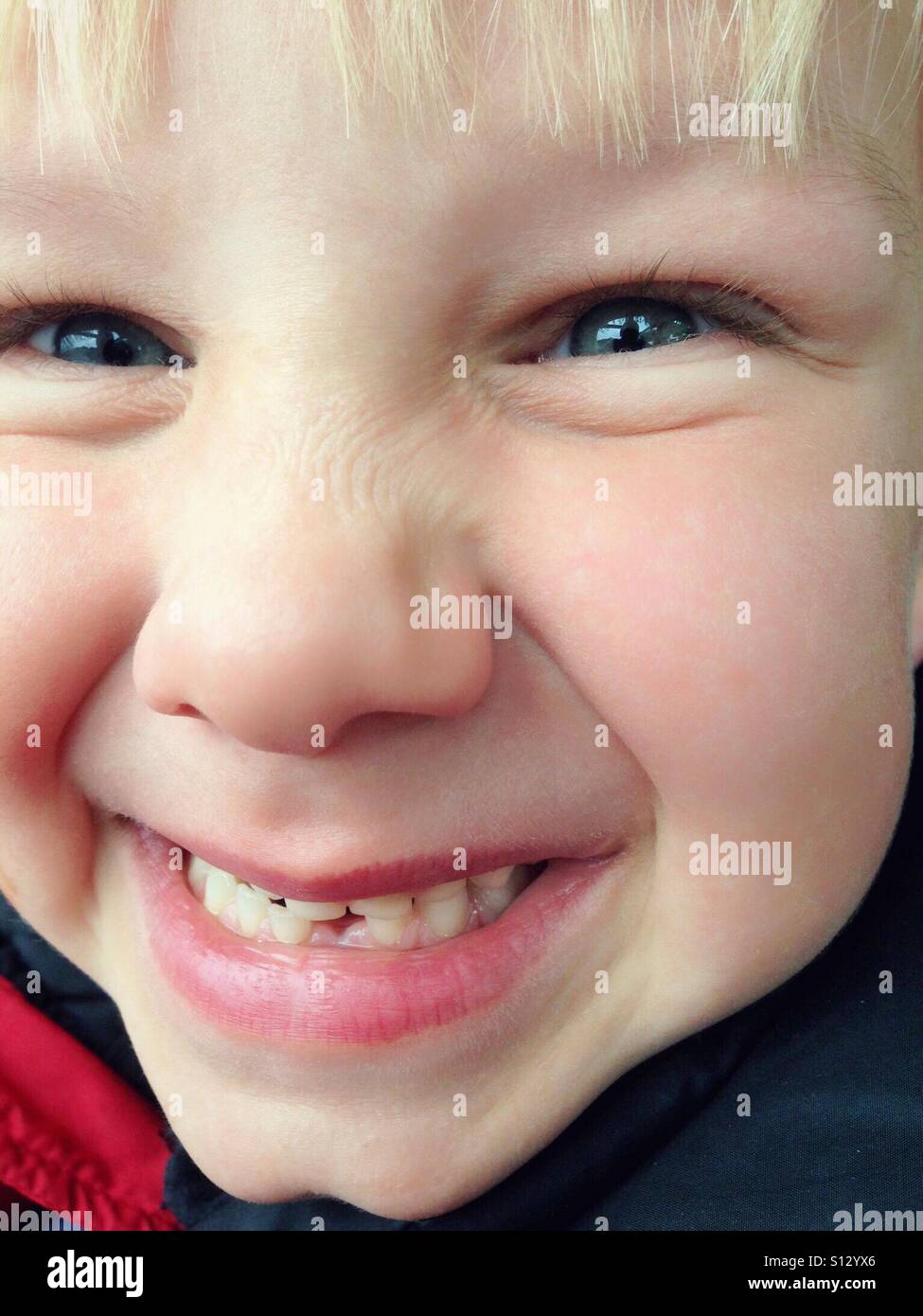 A boy shows off his first missing tooth Stock Photo - Alamy