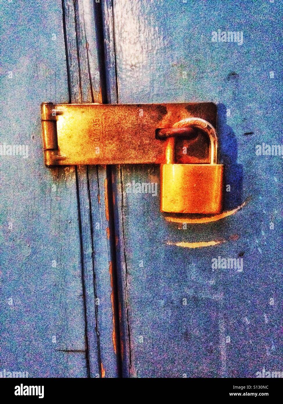 A padlocked garden cupboard Stock Photo - Alamy