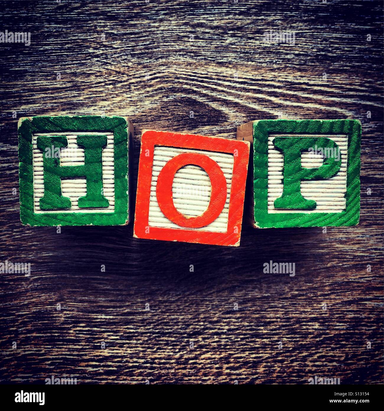 HOP word written with wood block letter toys Stock Photo - Alamy