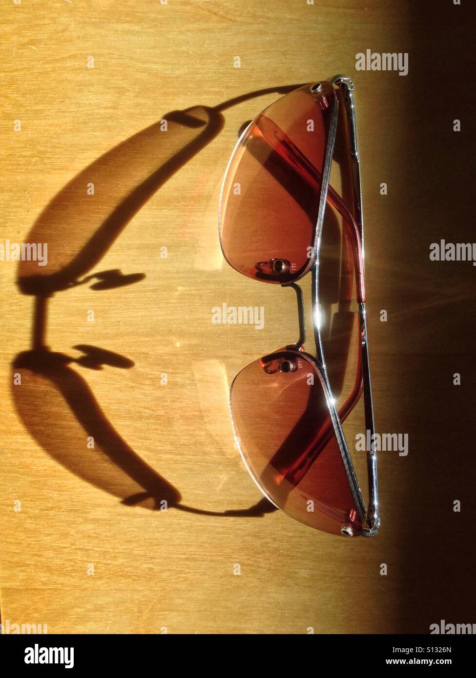 Pink sunglasses with shadow Stock Photo - Alamy