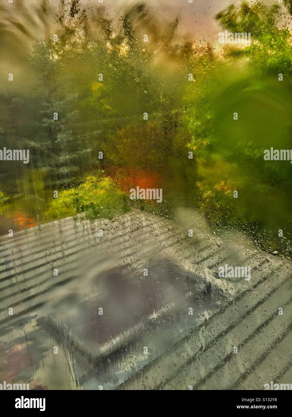 Flash photo through the kitchen window on a rainy day Stock Photo - Alamy