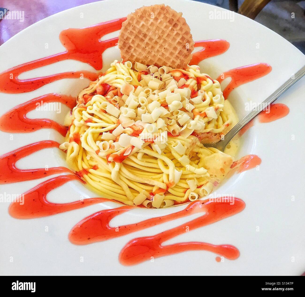 Funny dessert "spaghetti with cheese" made of ICE CREAM Stock Photo - Alamy