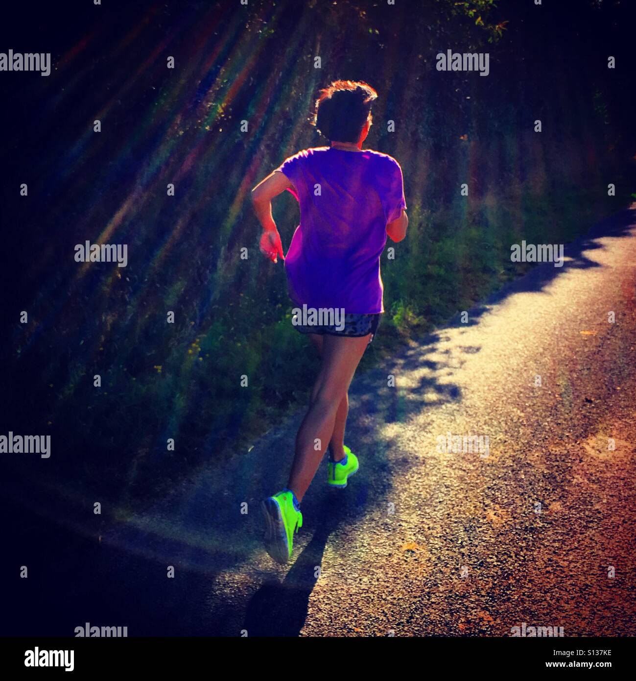 Running women view from the back Stock Photo - Alamy