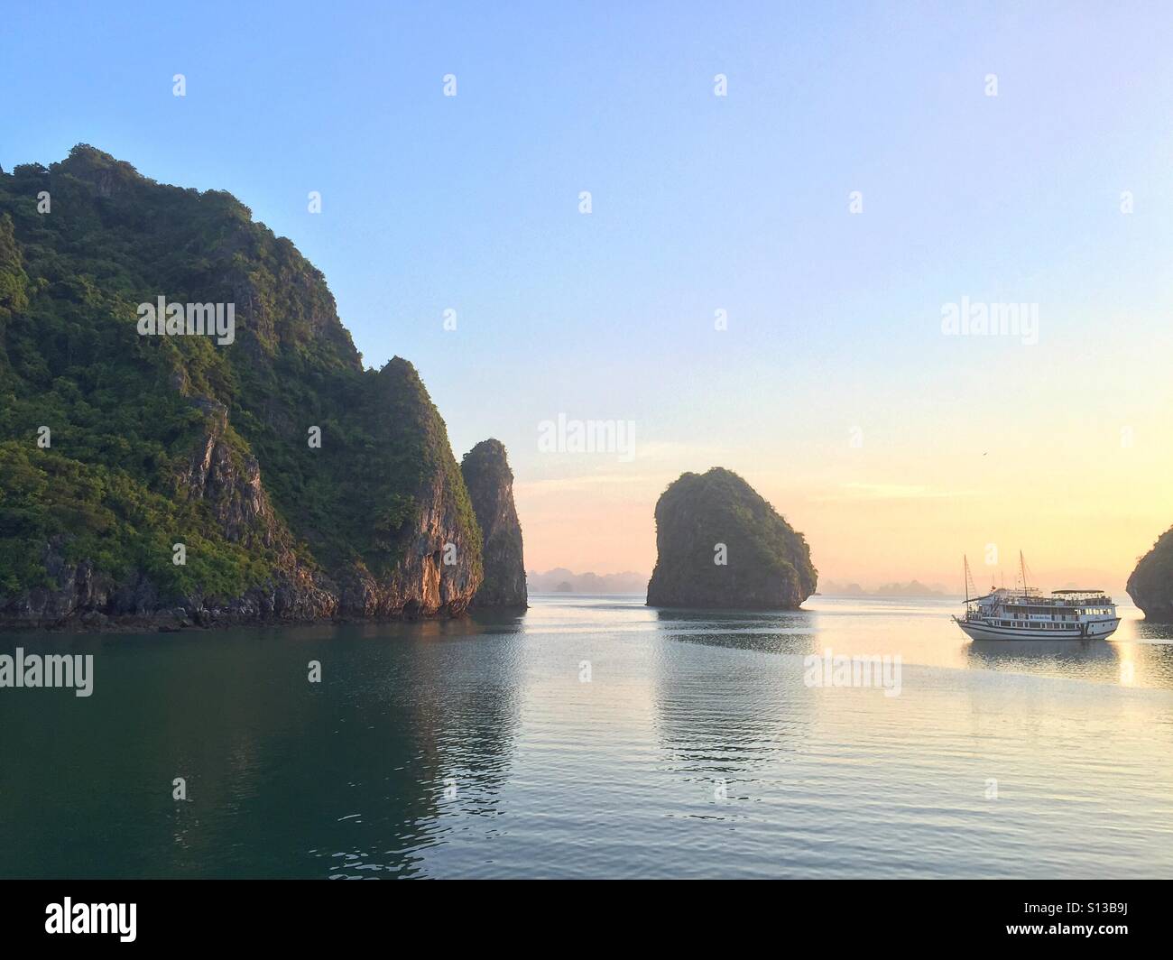 Sunrise in Ha Long Bay Stock Photo - Alamy