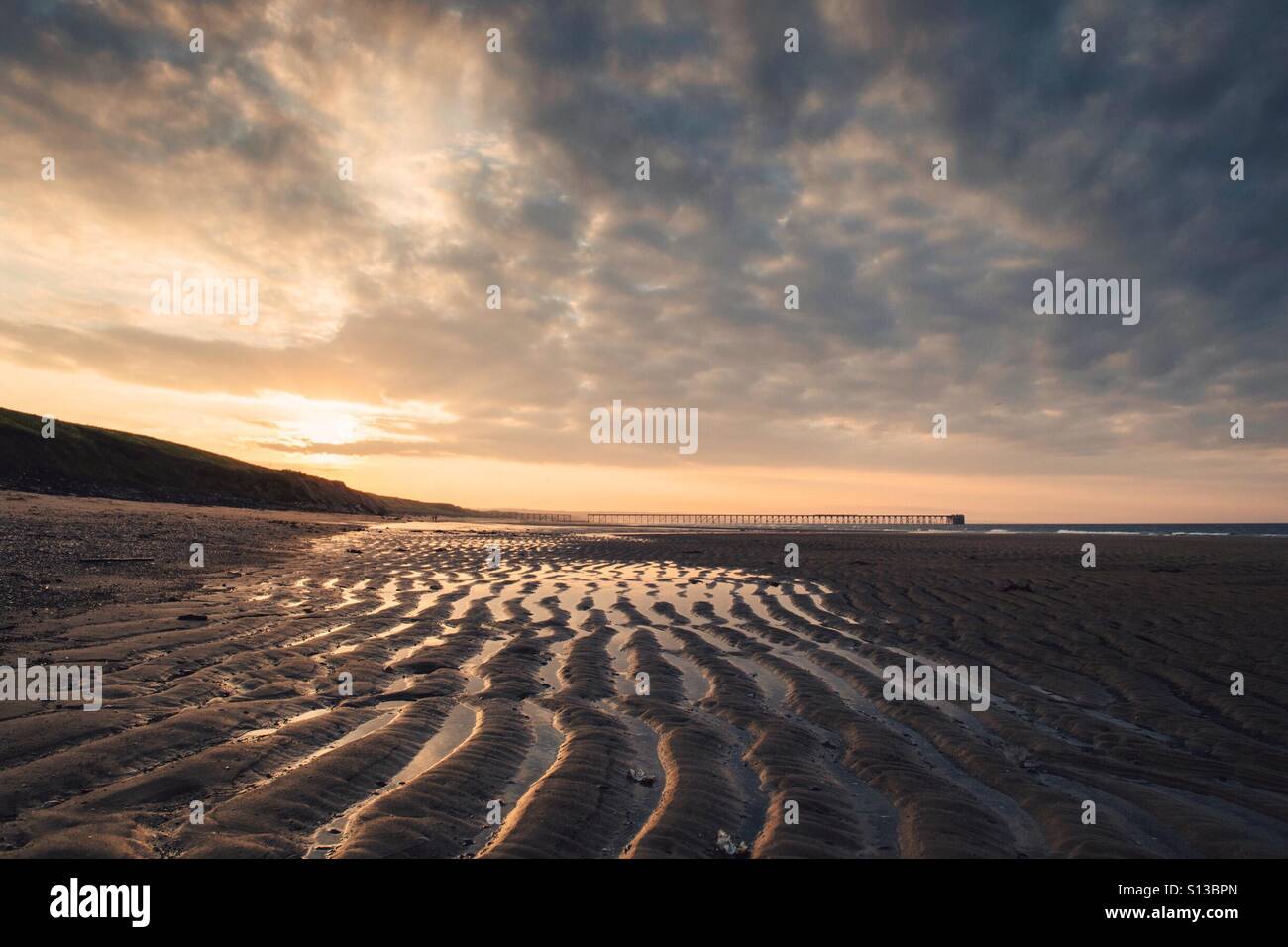 The sun setting over the Headland beach, Hartlepool, UK Stock Photo - Alamy