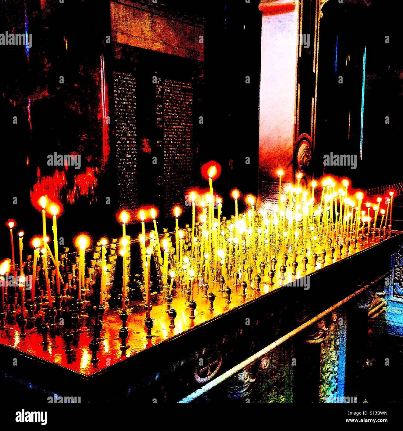 Candles burning at a church Stock Photo - Alamy