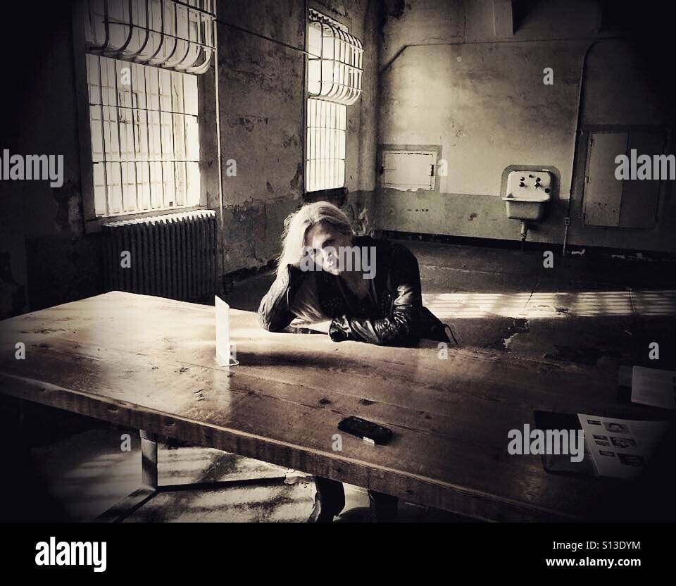Women prison bars hi-res stock photography and images - Alamy