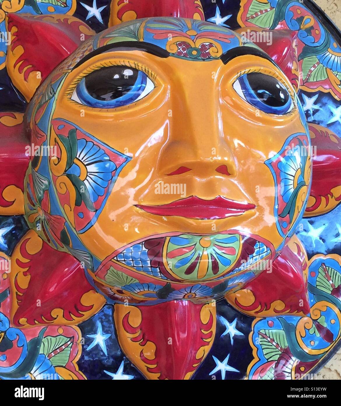 Multicolored sun face Stock Photo - Alamy