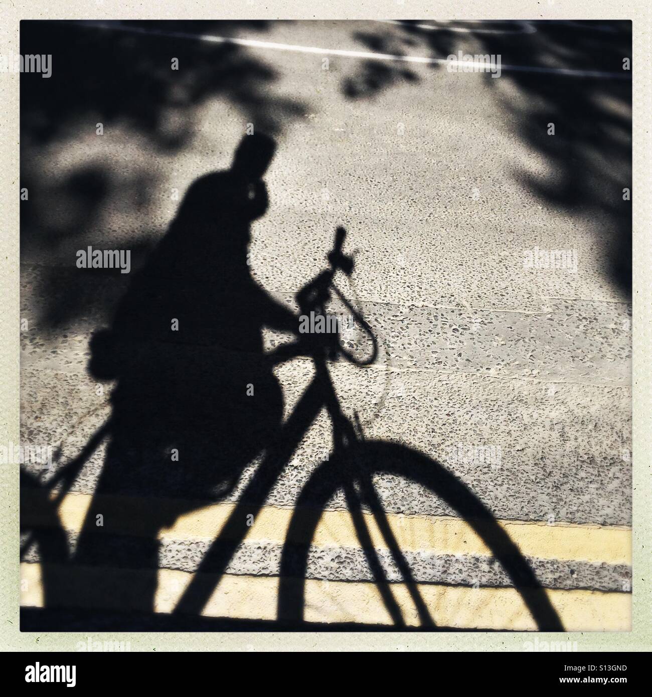 Shadow of cyclist Stock Photo - Alamy