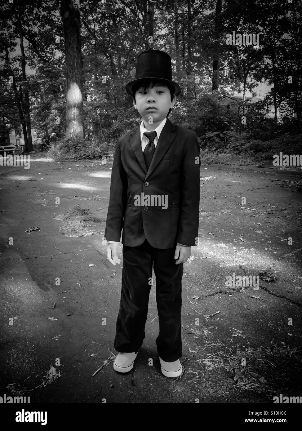 Dressed up boy with top hat Stock Photo - Alamy