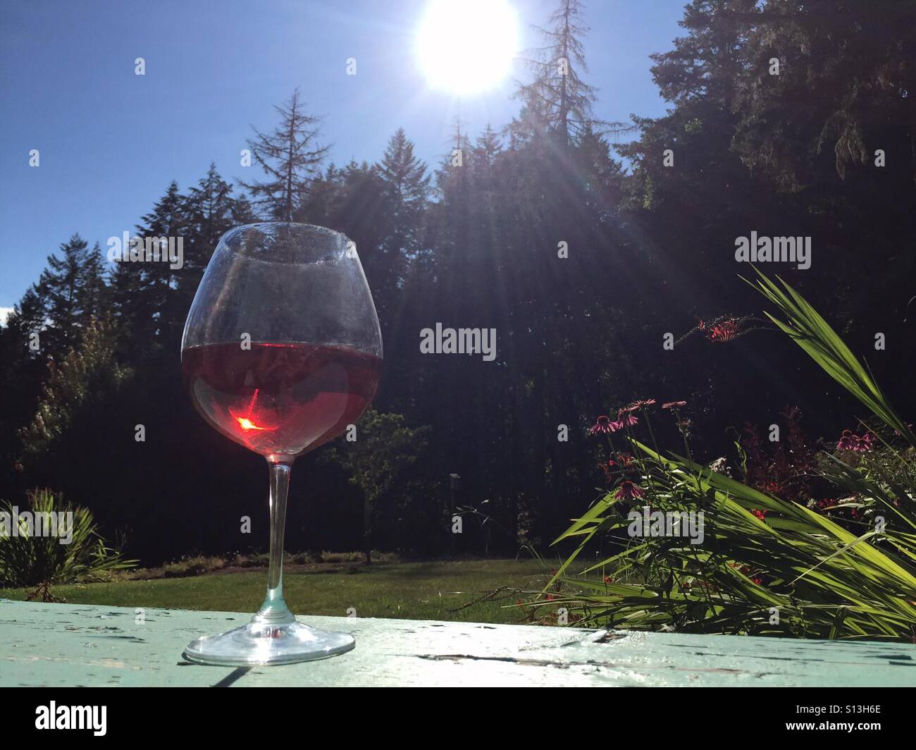 A perfect Summer evening relaxing with wine on the patio Stock Photo ...