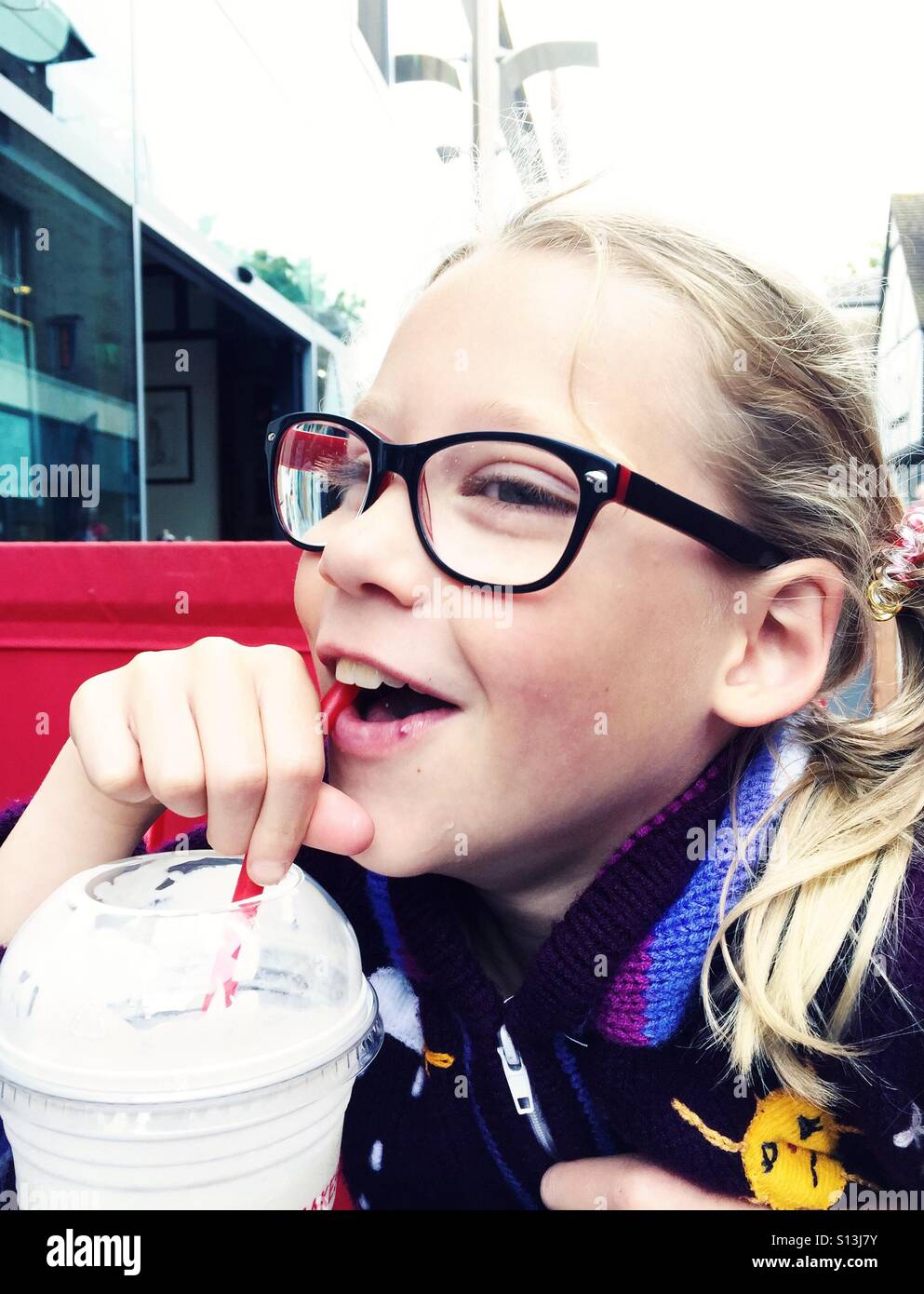 Drinking a milkshake Stock Photo - Alamy