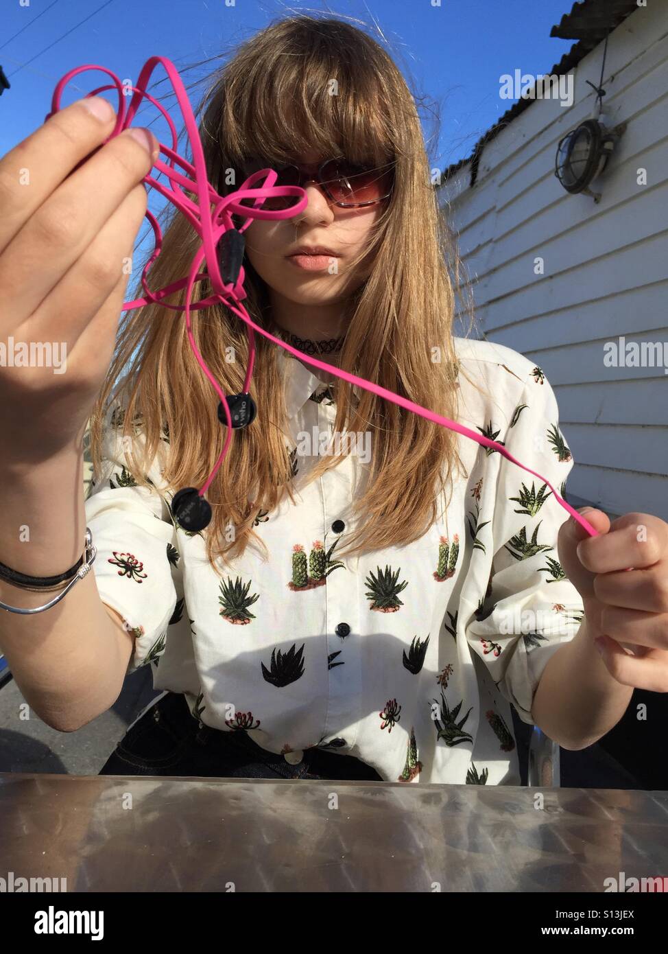 Tangled earphones hi-res stock photography and images - Alamy