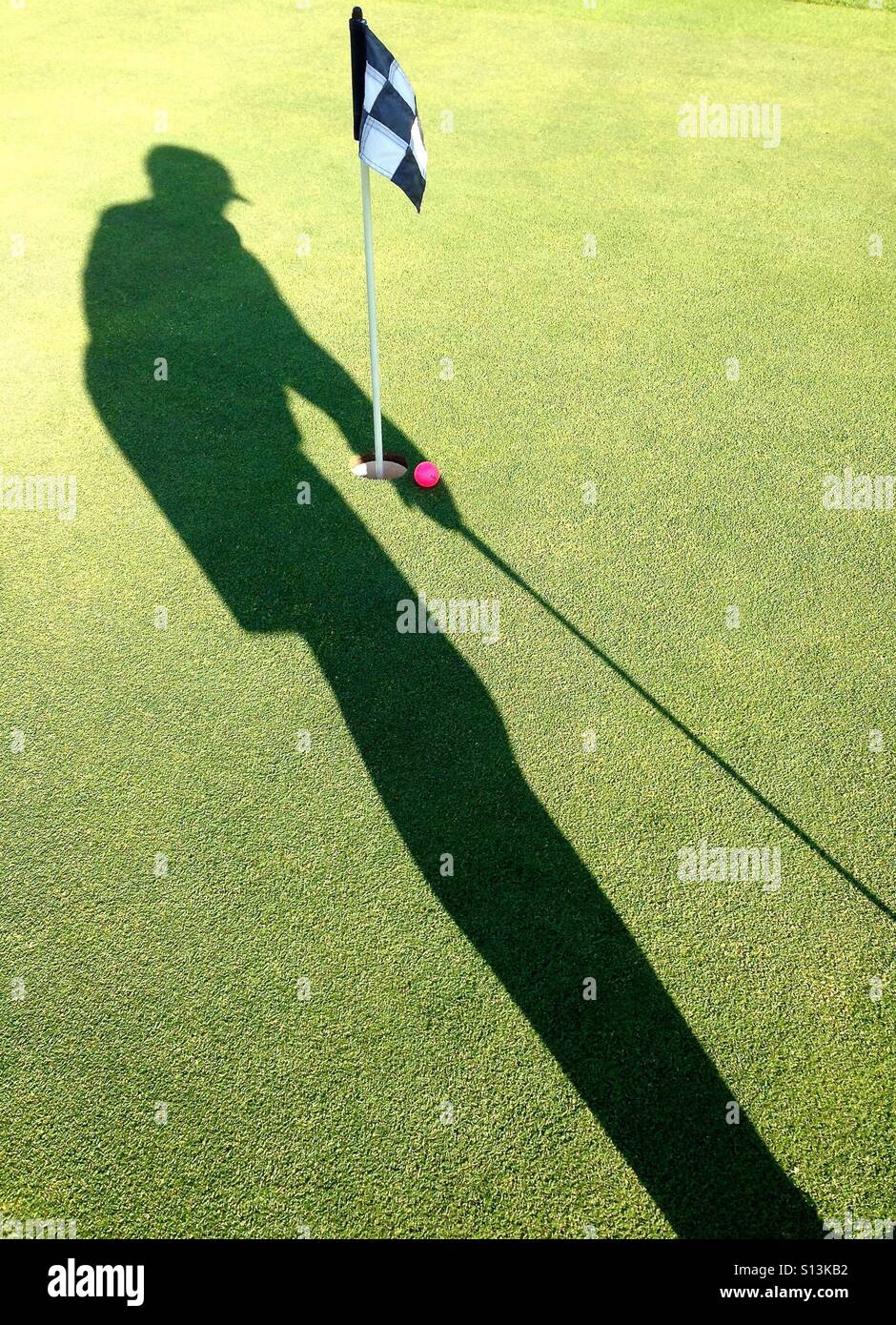 Shadow of golf flag hi-res stock photography and images - Alamy