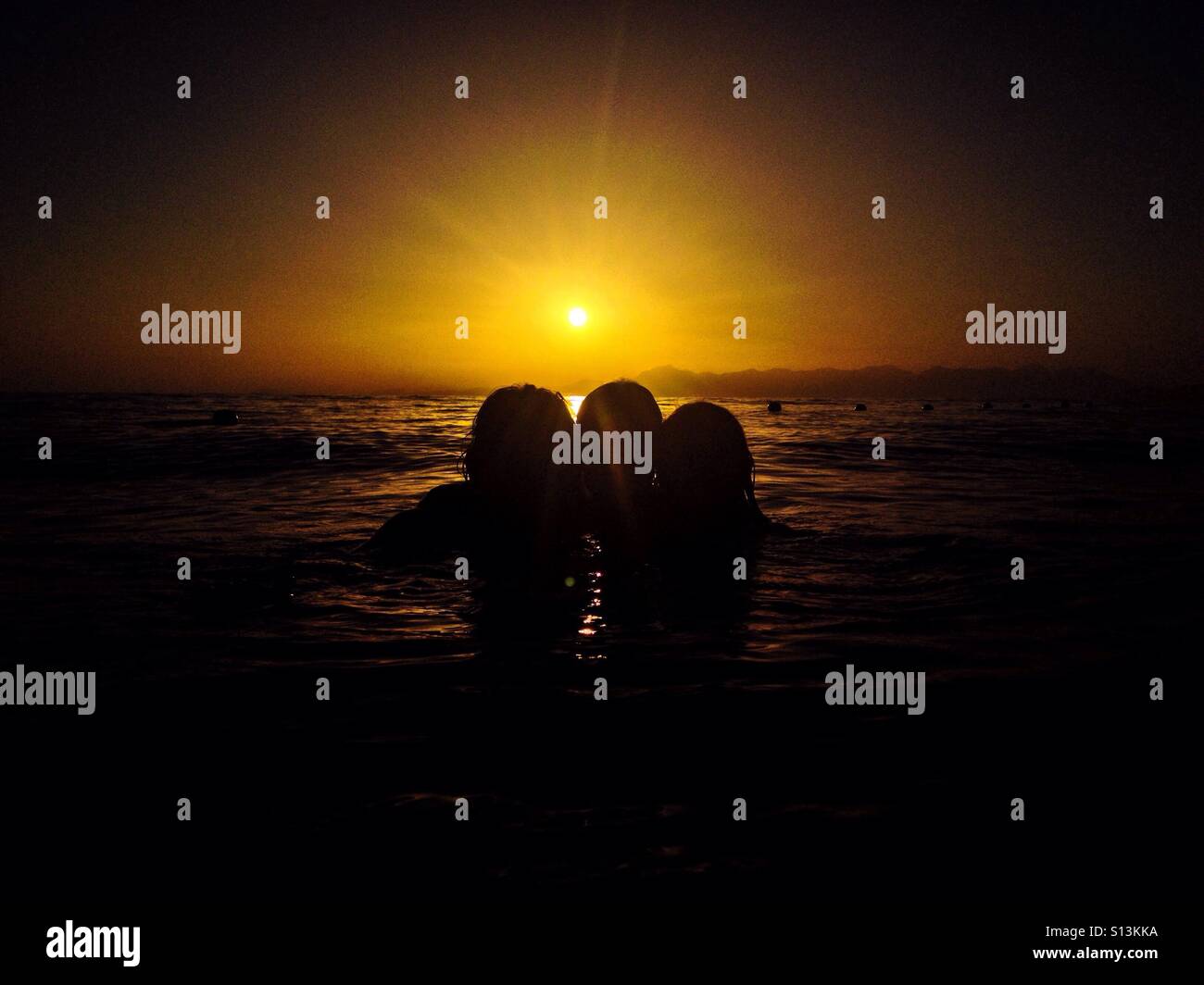 People at the sunrise Stock Photo - Alamy