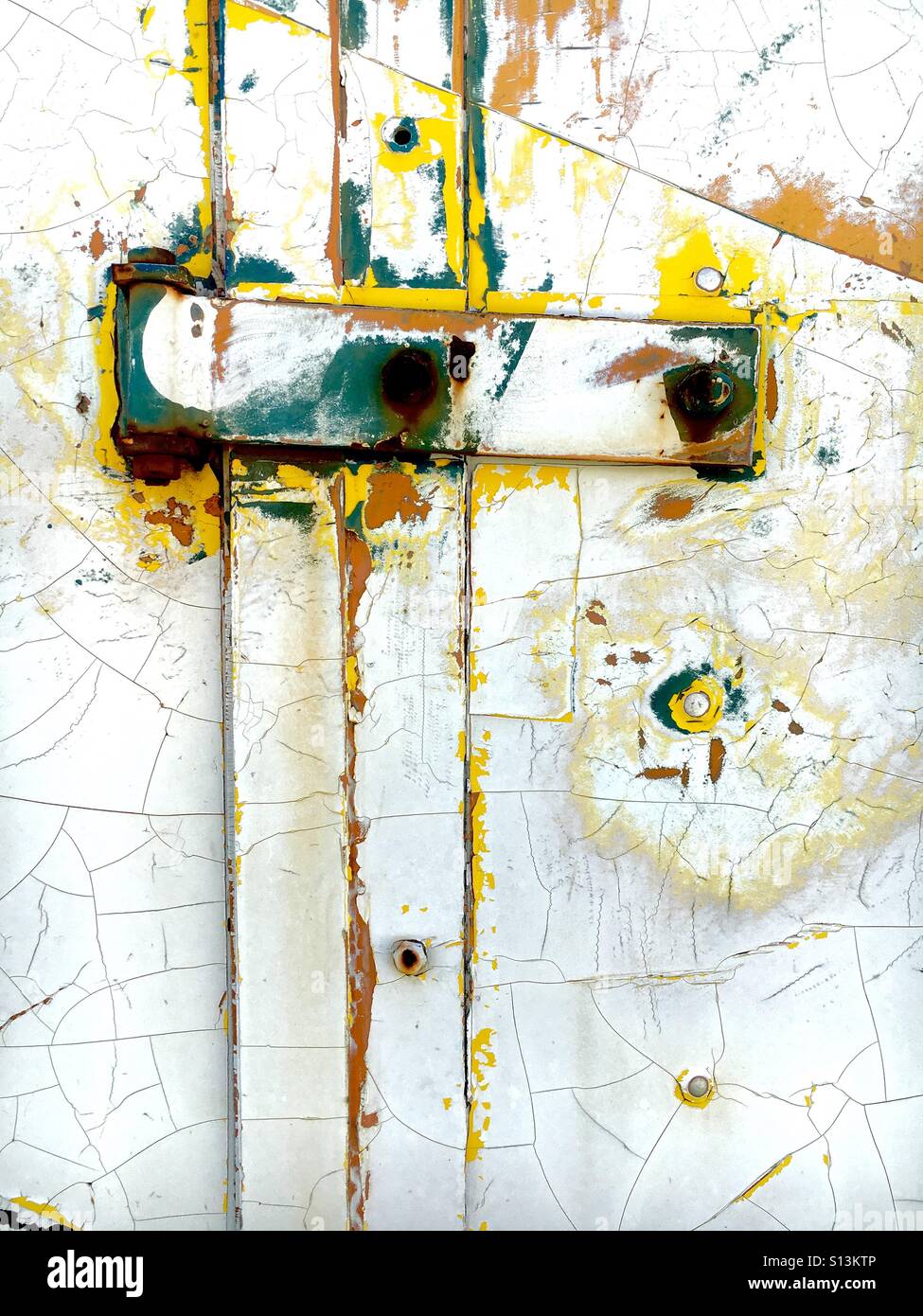 Steel rivets and latch with cracked paint Stock Photo - Alamy