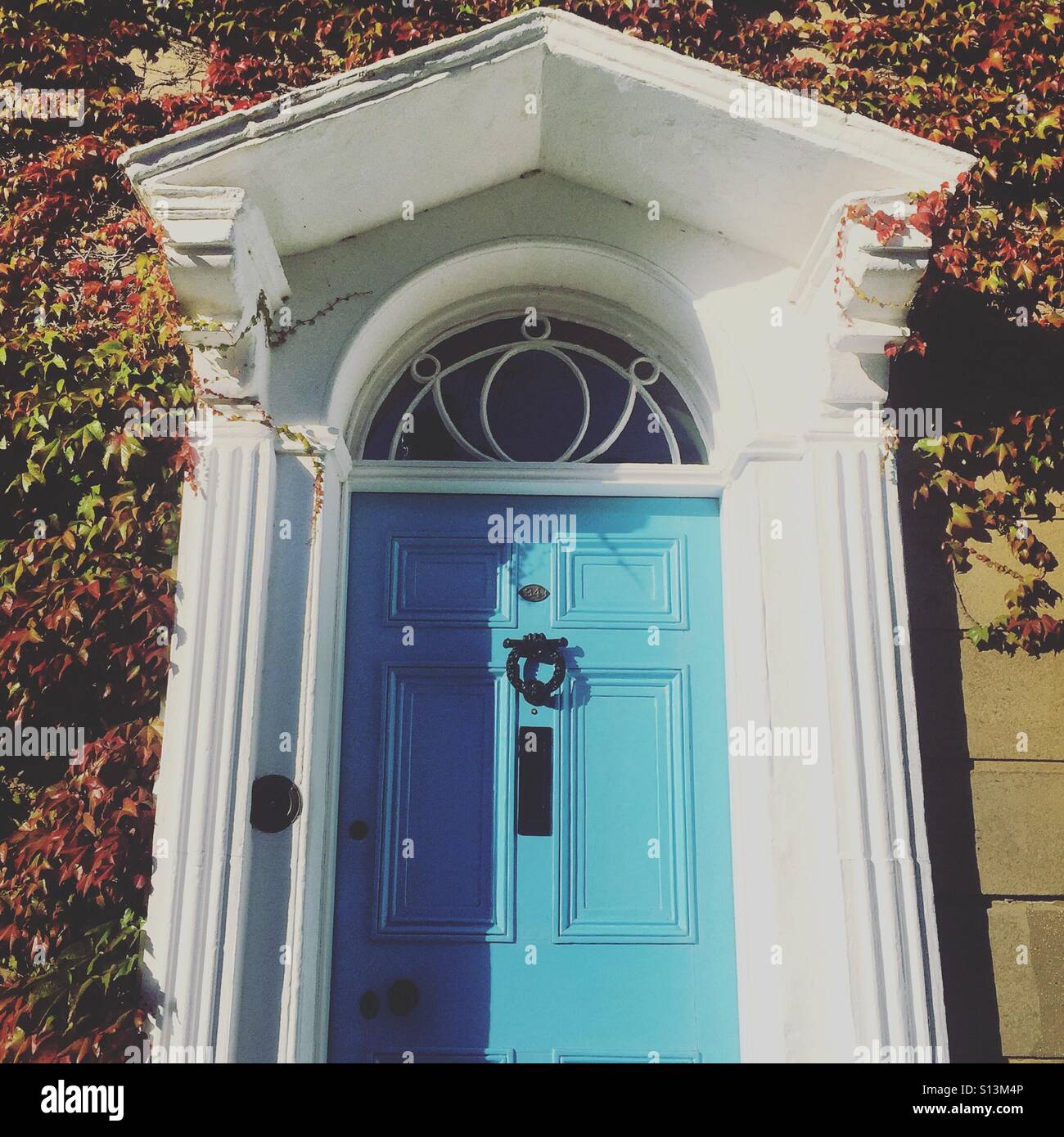 Turquoise front door Stock Photo - Alamy