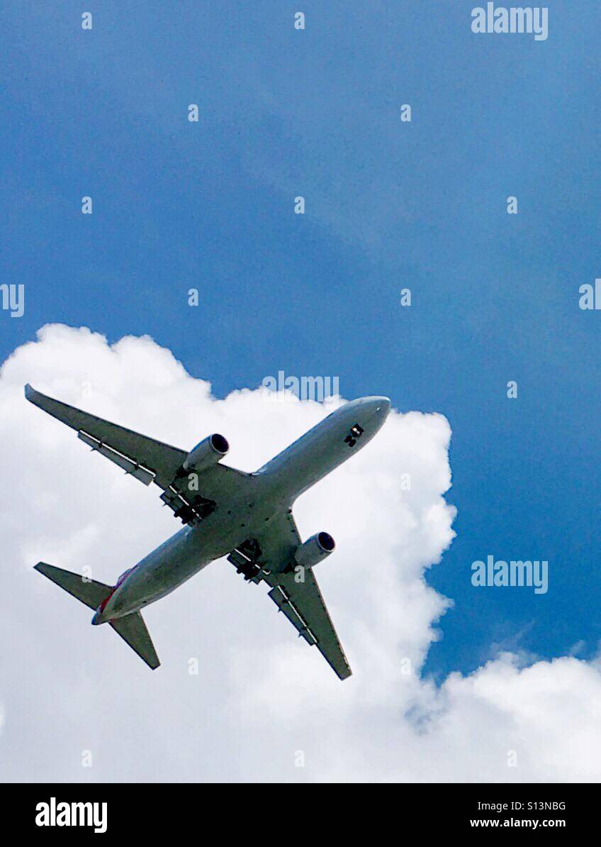 Plane in the sky Stock Photo - Alamy