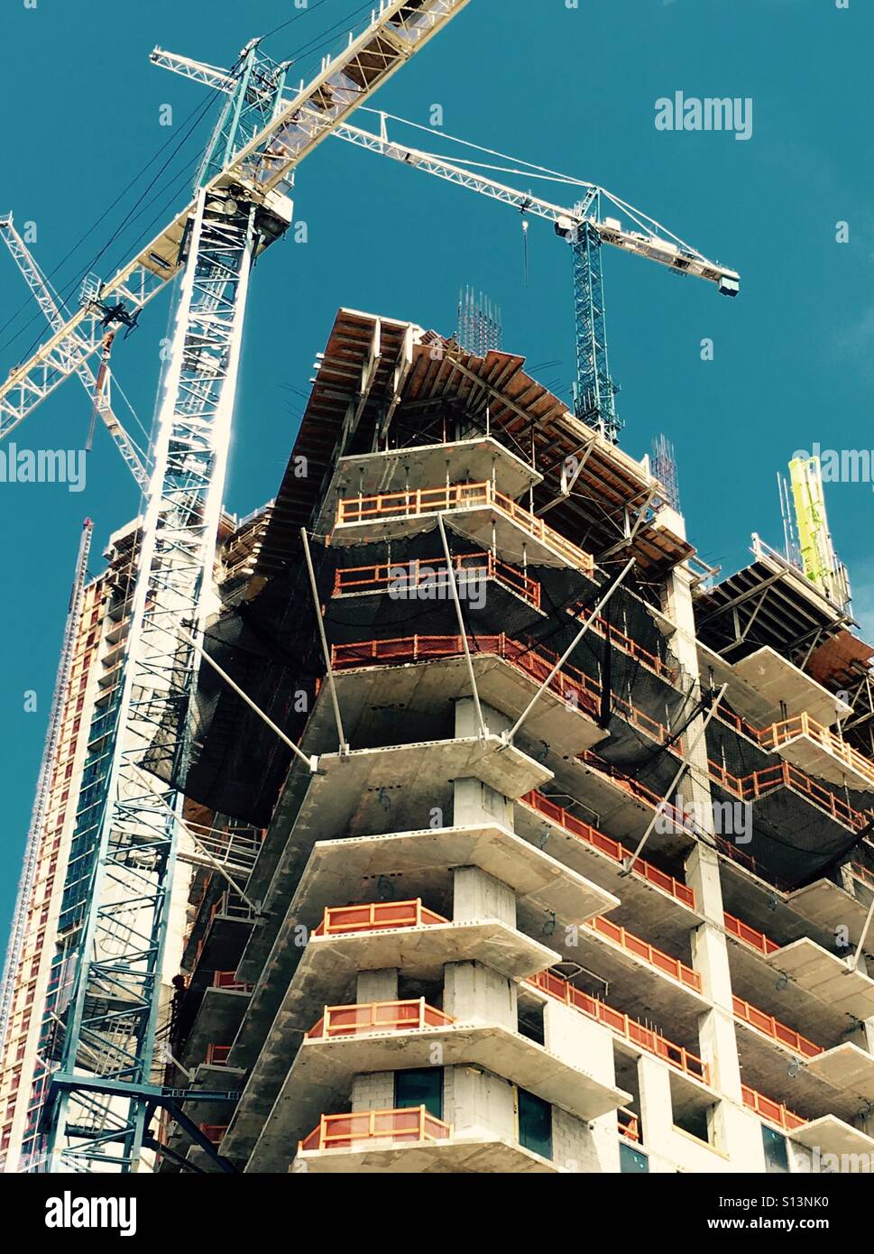 High rise construction site with tower cranes Stock Photo - Alamy