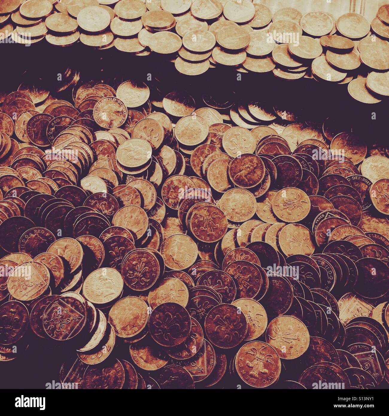 Coins in a penny cascade slot machine in an amusement arcade Stock ...