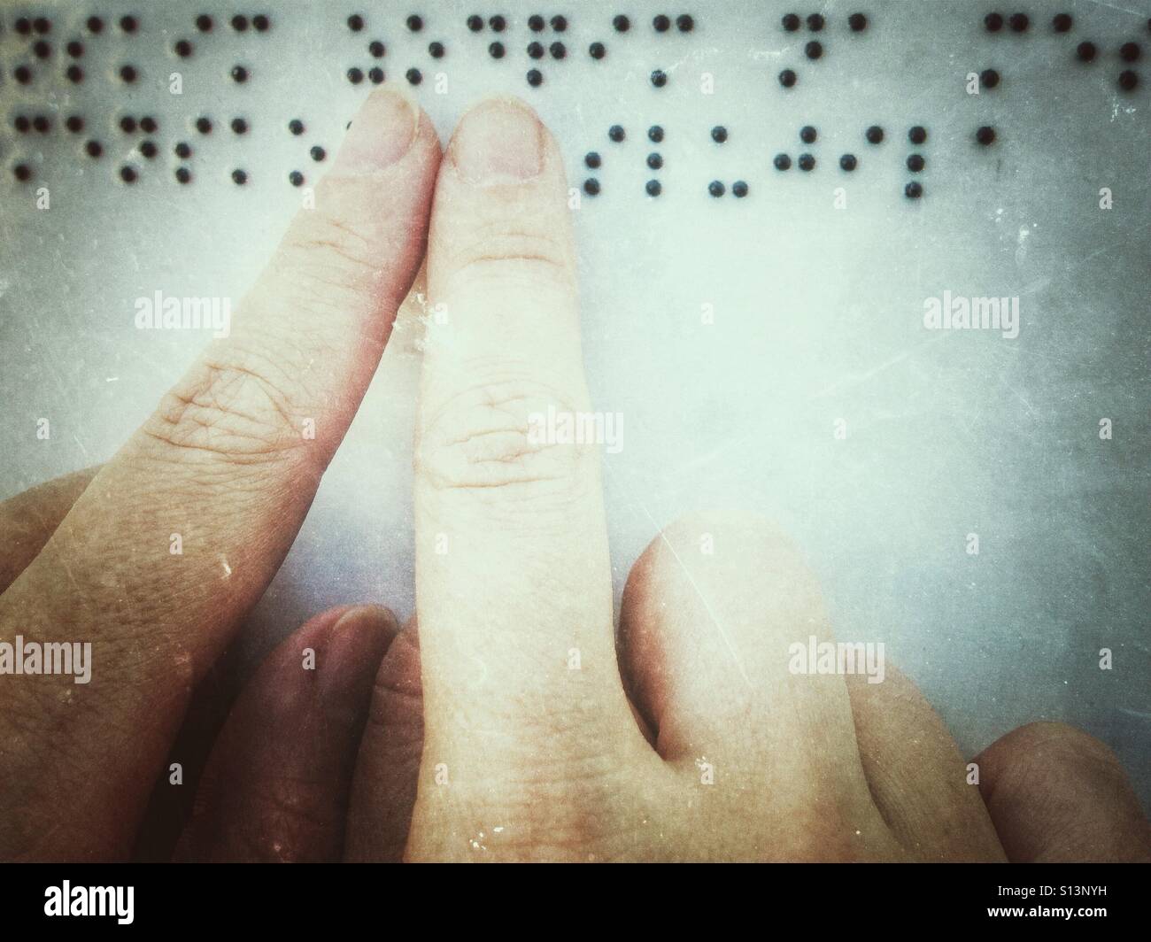 Reading the Braille plate Stock Photo - Alamy