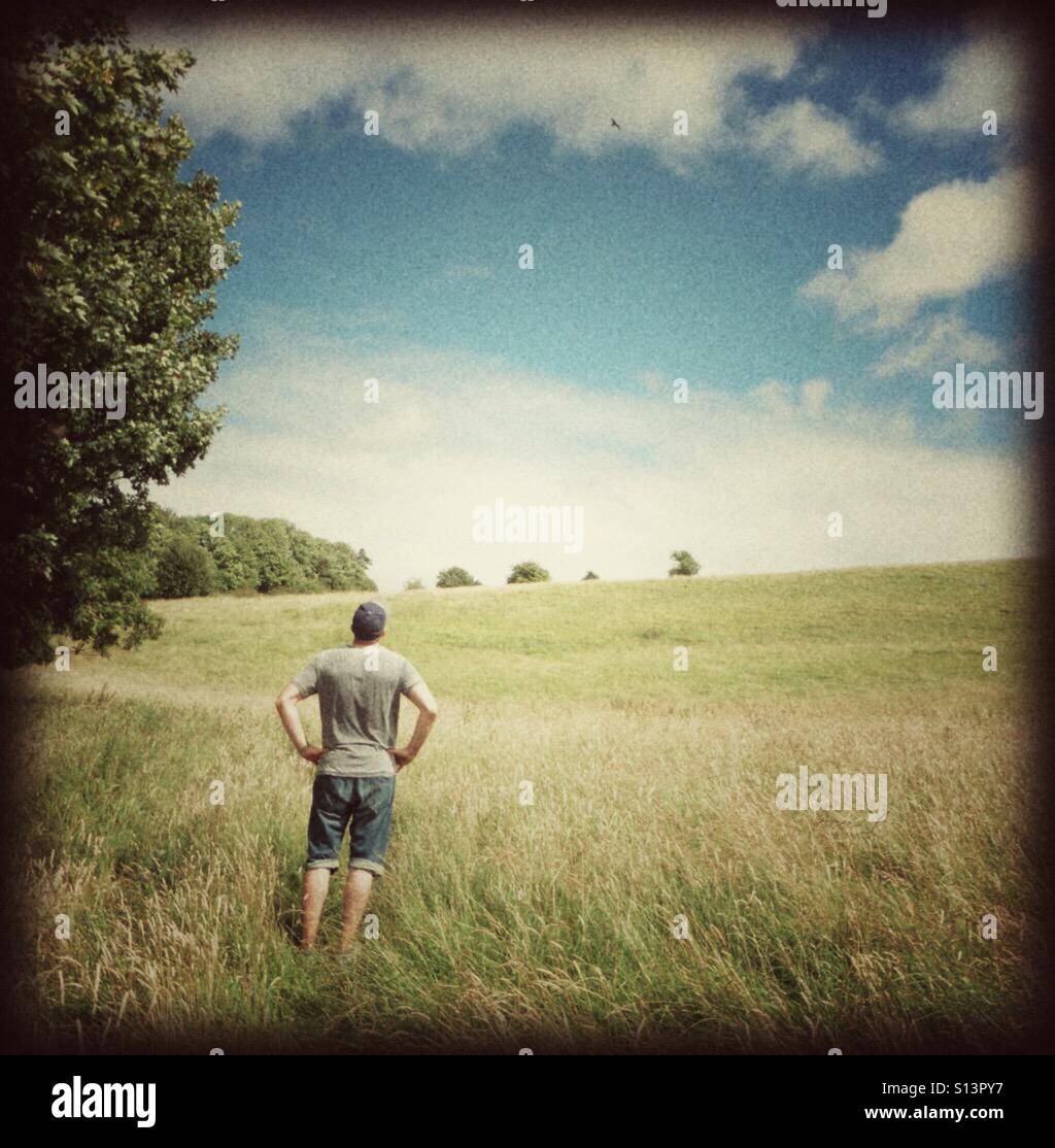 Man in field Stock Photo - Alamy
