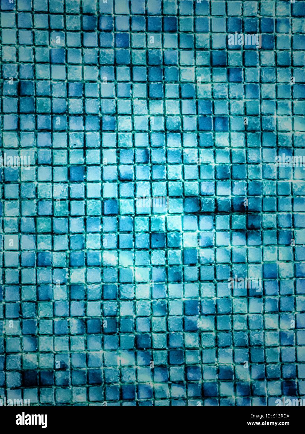 Tiles of a swimming pool, through still water Stock Photo - Alamy