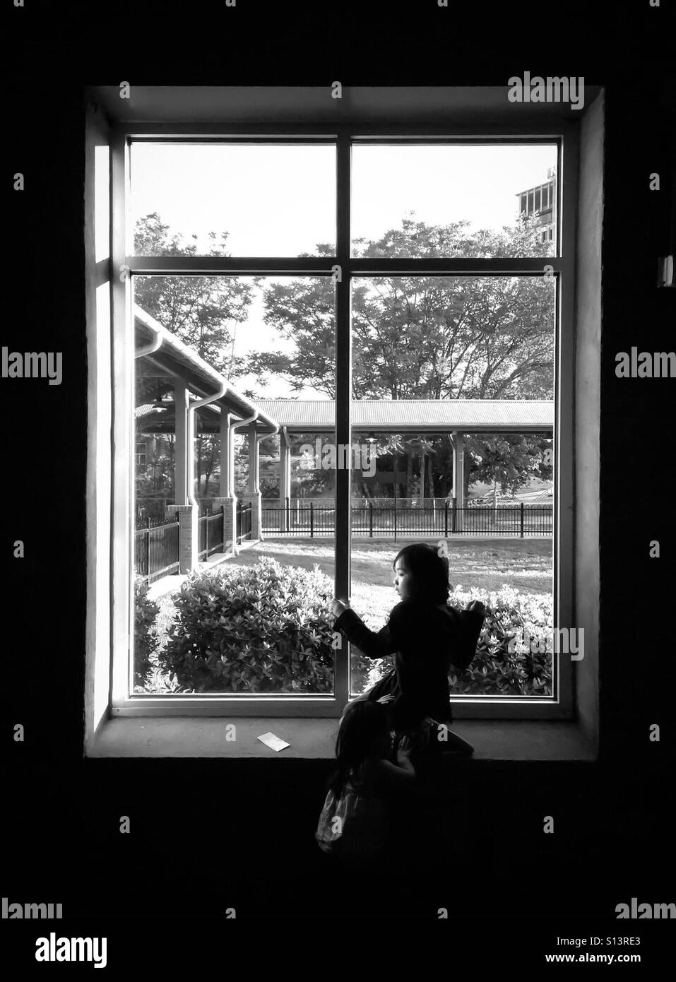 Looking out the window, waiting for the train Stock Photo - Alamy