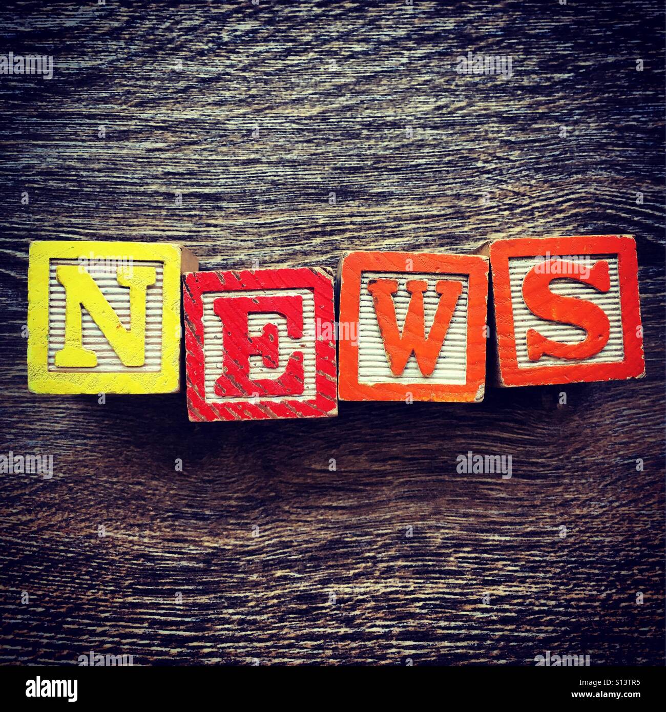 NEWS word written with wood block letter toys Stock Photo - Alamy