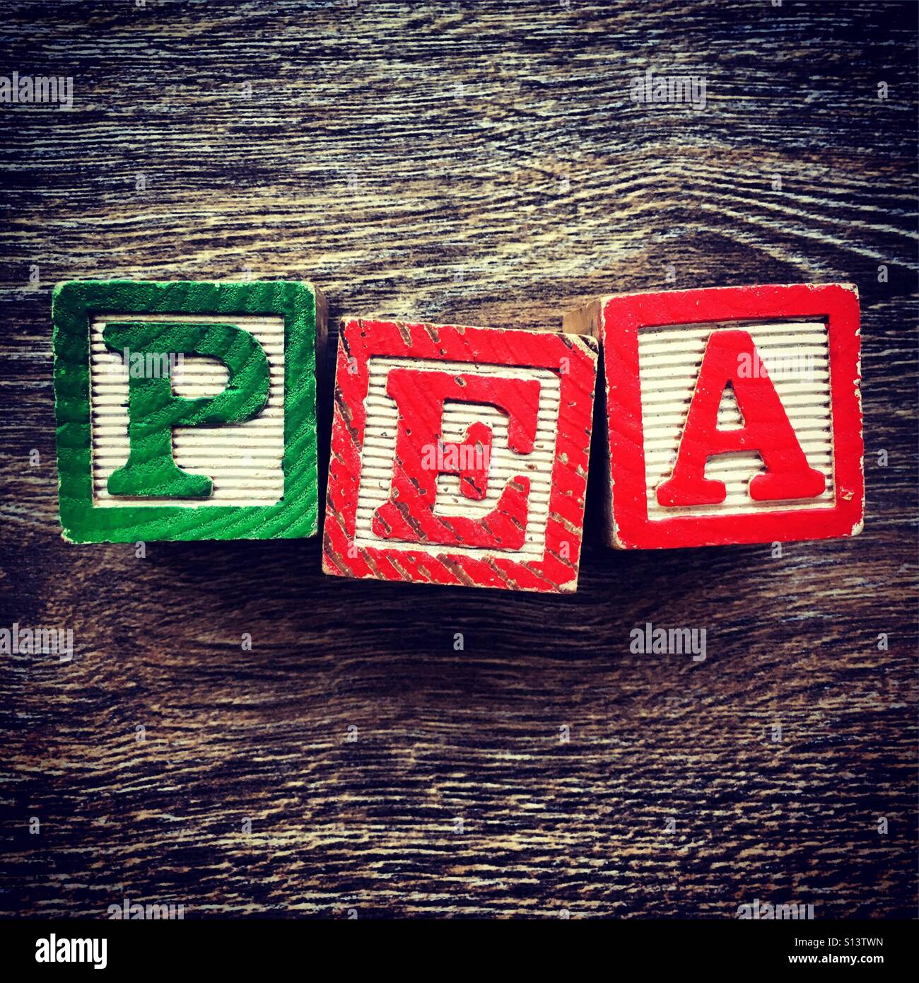PEA word written with wood block letter toys Stock Photo - Alamy