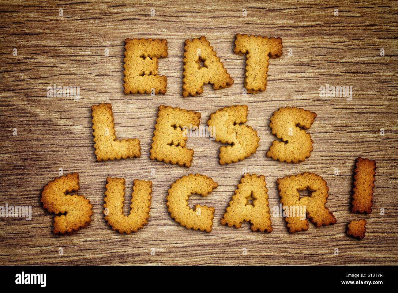 Food advice asking people to 'eat less sugar' by using alphabet shapes ...