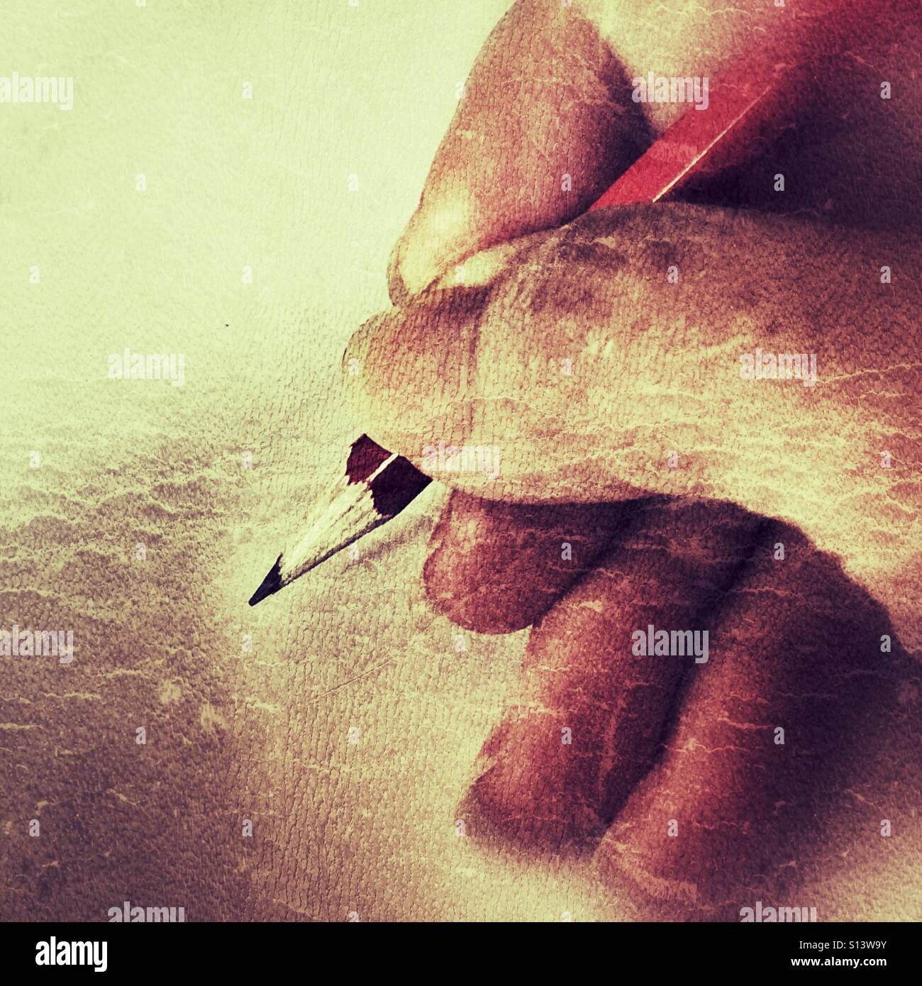 Hand holding pencil over blank paper Stock Photo - Alamy