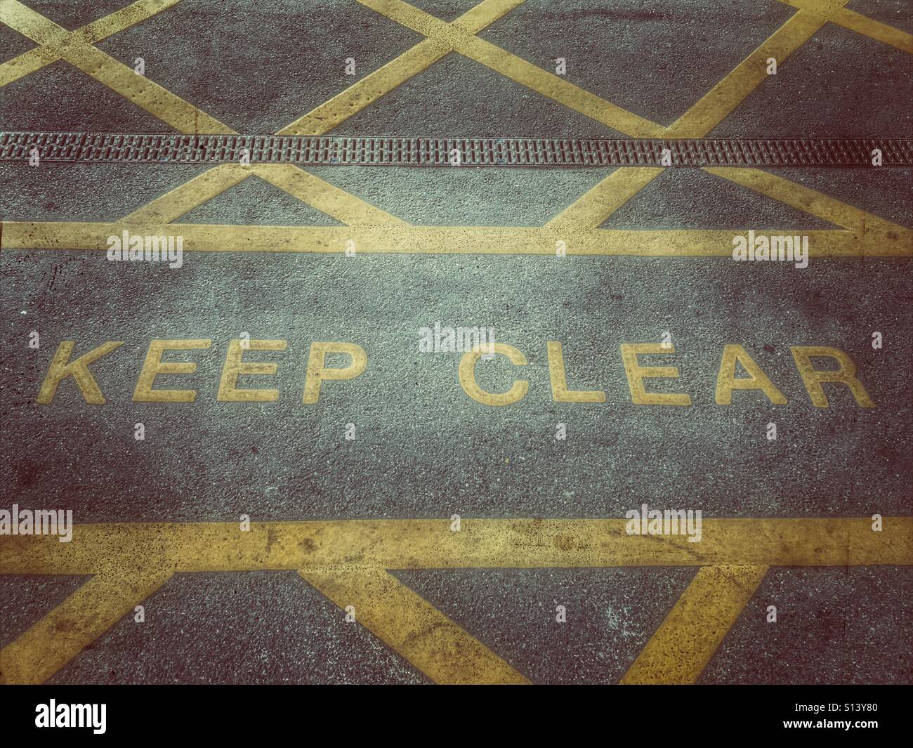 Keep clear sign on Tarmac Stock Photo - Alamy