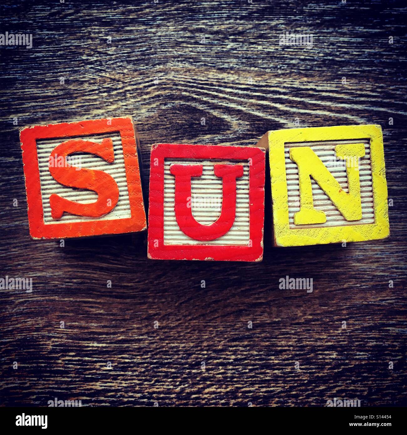 SUN word written with wood block letter toys Stock Photo - Alamy