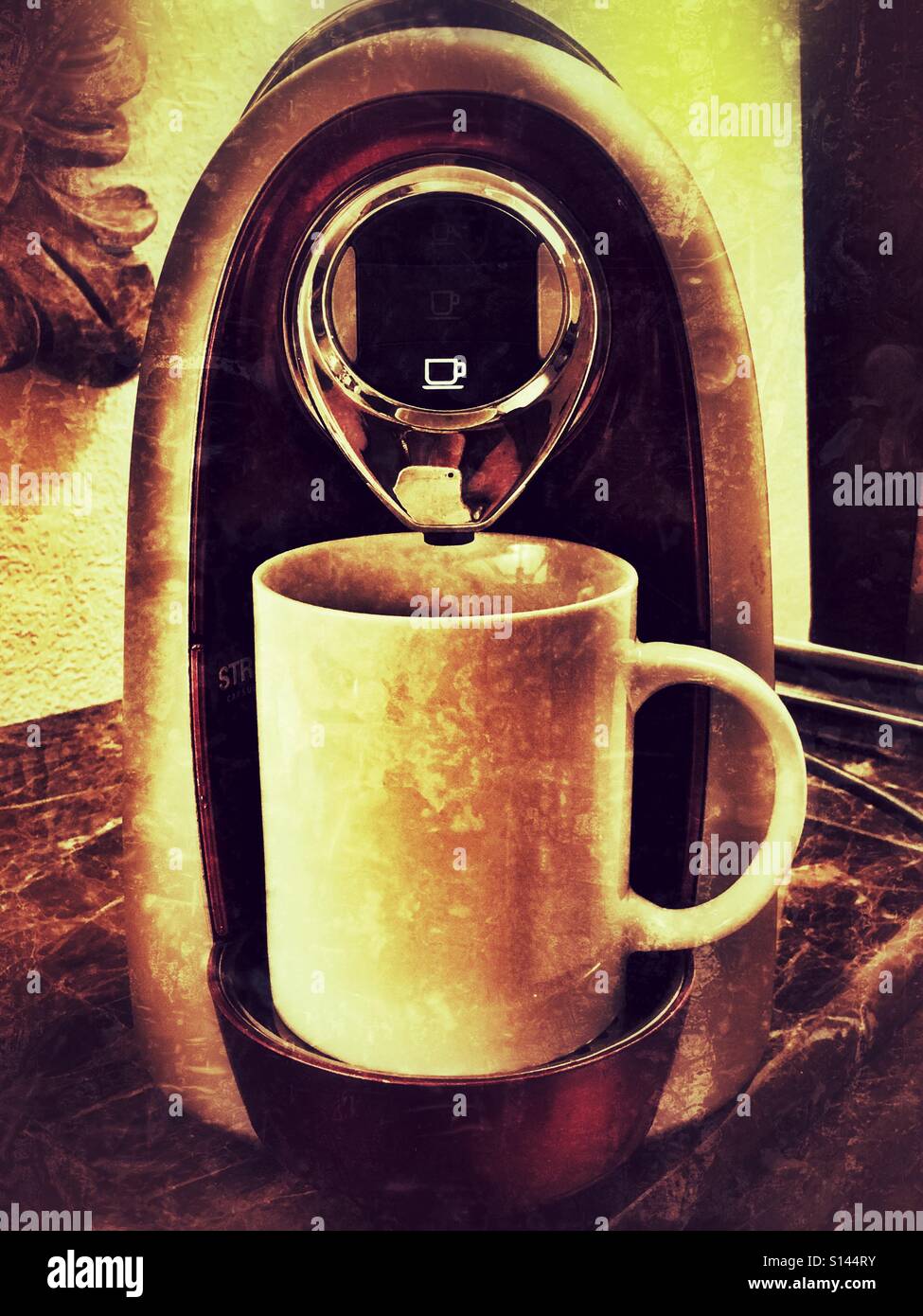 Coffee machine with mug in place Stock Photo - Alamy