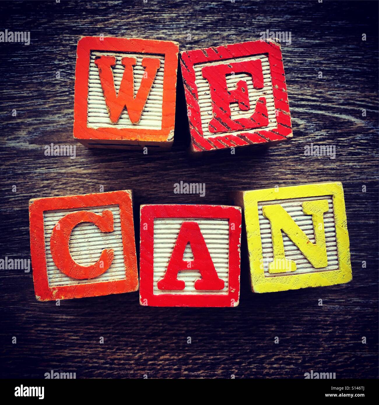 WE CAN word written with wood block characters Stock Photo - Alamy